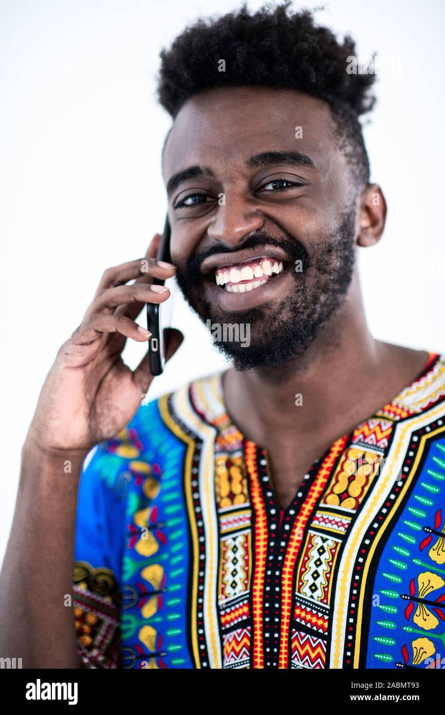 native sudan african male using smart phone isolated on white ...