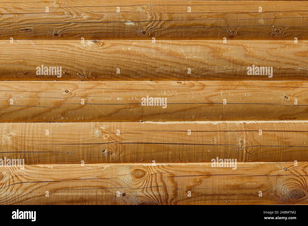 Wooden wall from logs of pine as a background texture Stock Photo - Alamy