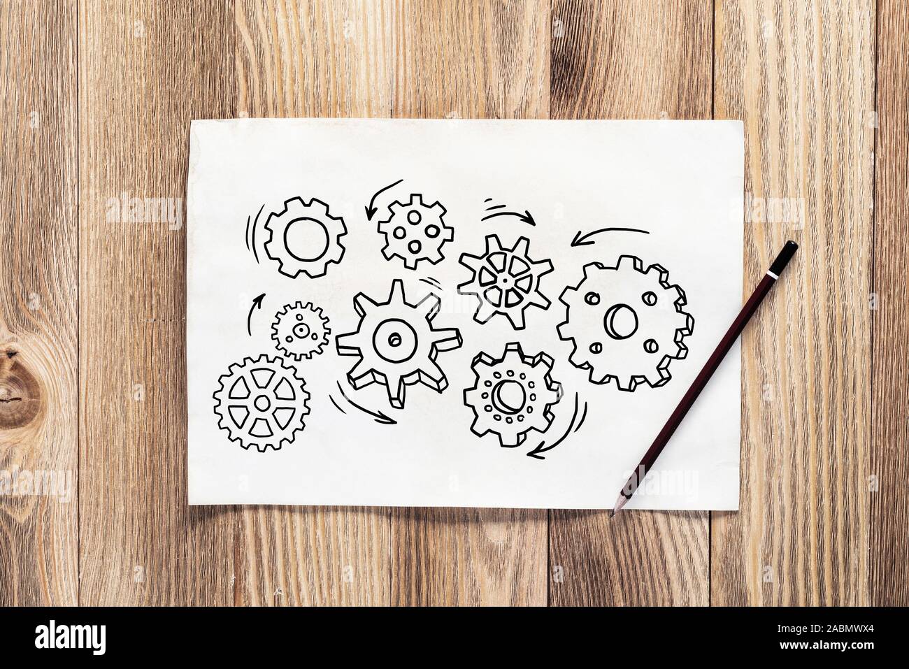 Group of rotating gears pencil hand drawn Stock Photo - Alamy