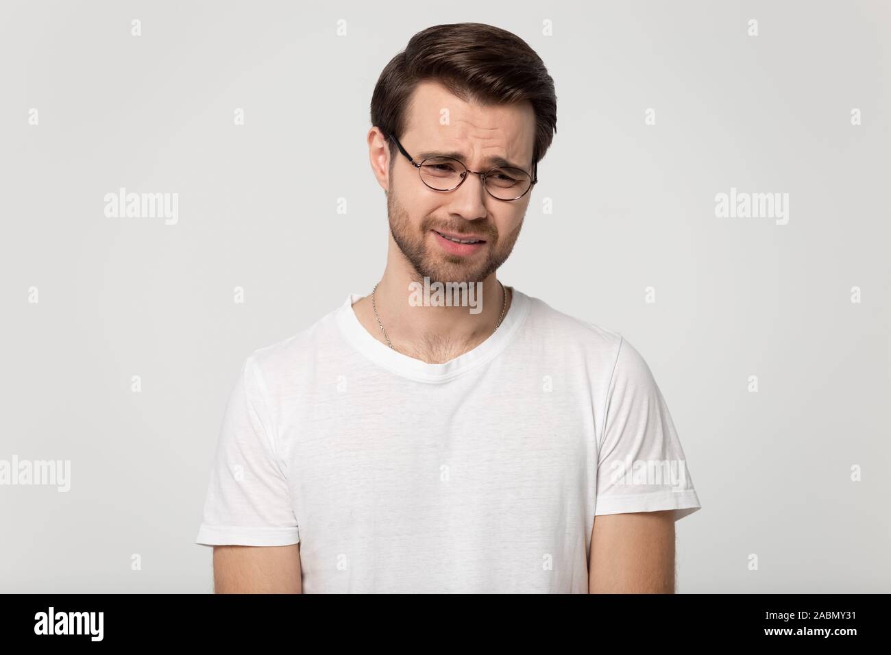 Unhappy Caucasian man isolated in studio crying having problems Stock ...