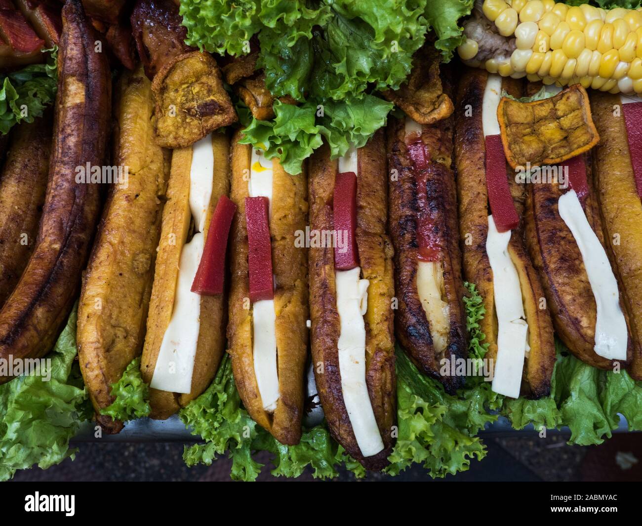 Roasted bananas with cheese, traditional colombian food Stock Photo - Alamy
