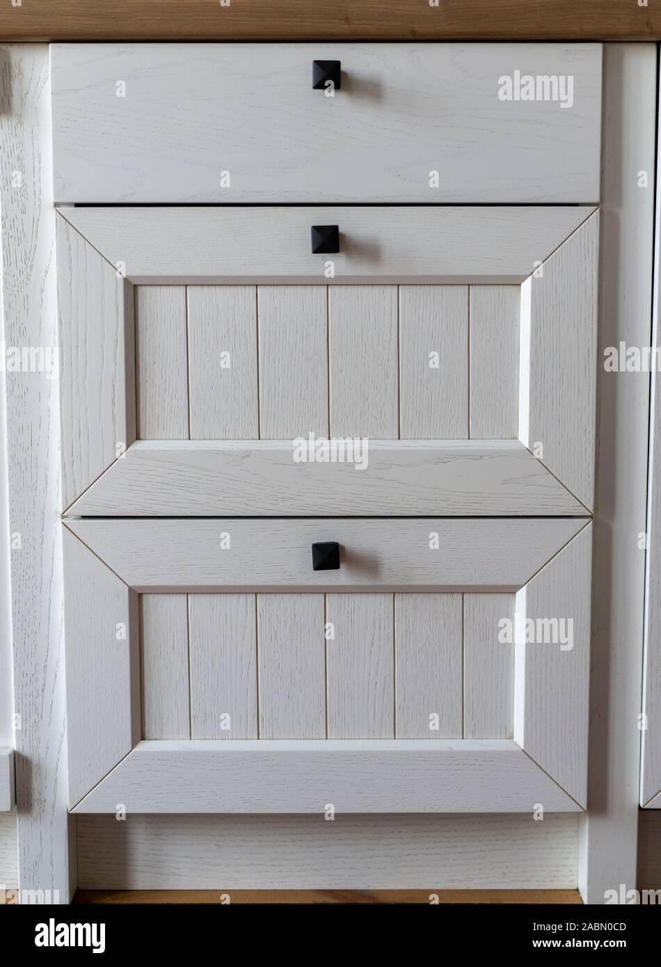 beautiful modern white kitchen drawers made of solid wood close-up ...