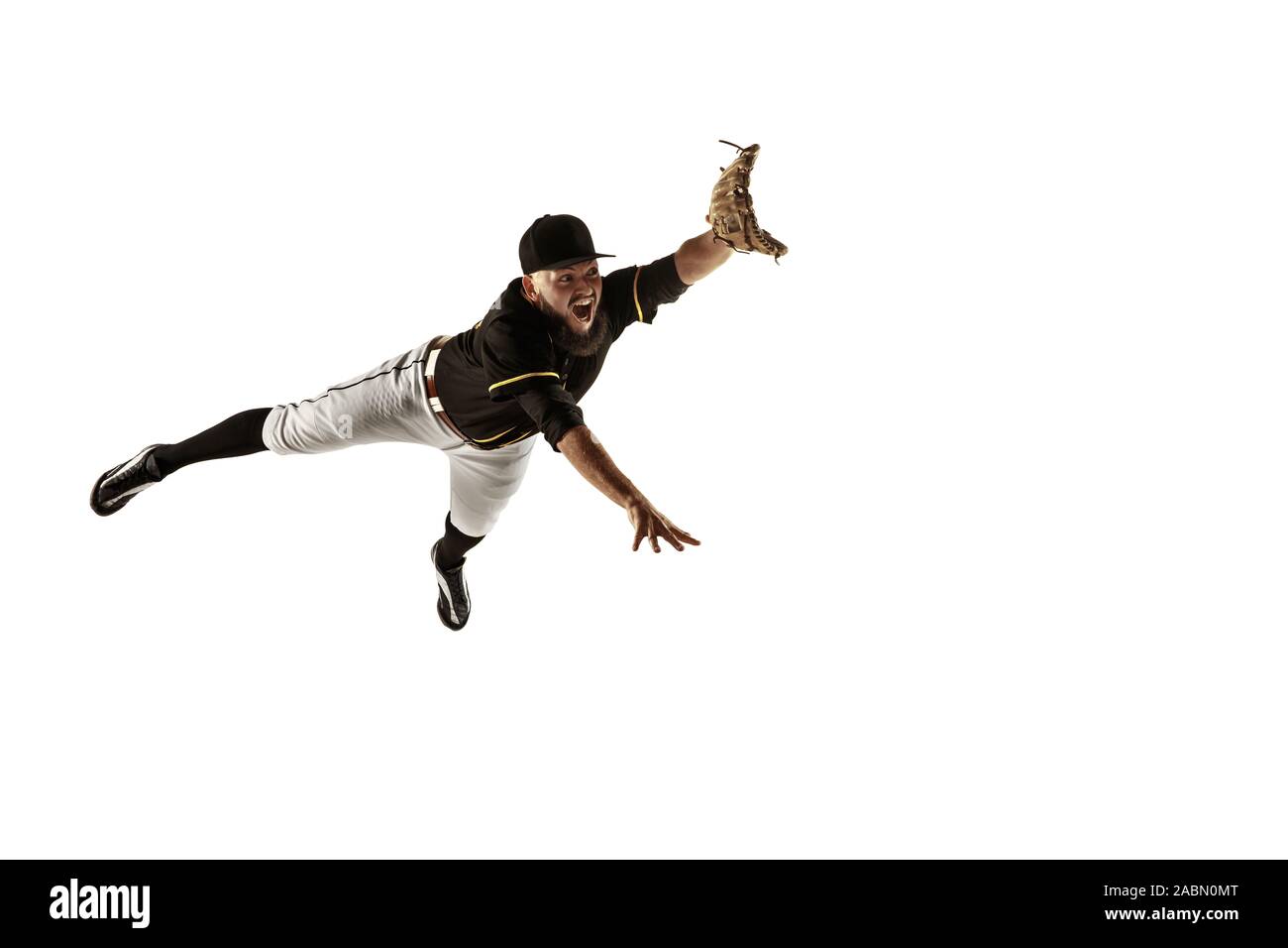 In flight. Baseball player, pitcher in black uniform practicing and ...