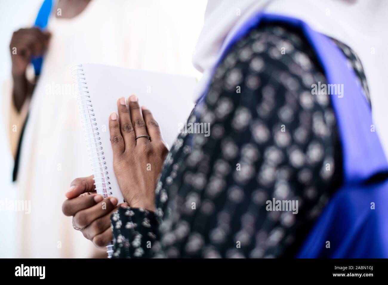 group of happy african students having conversation and team meeting ...
