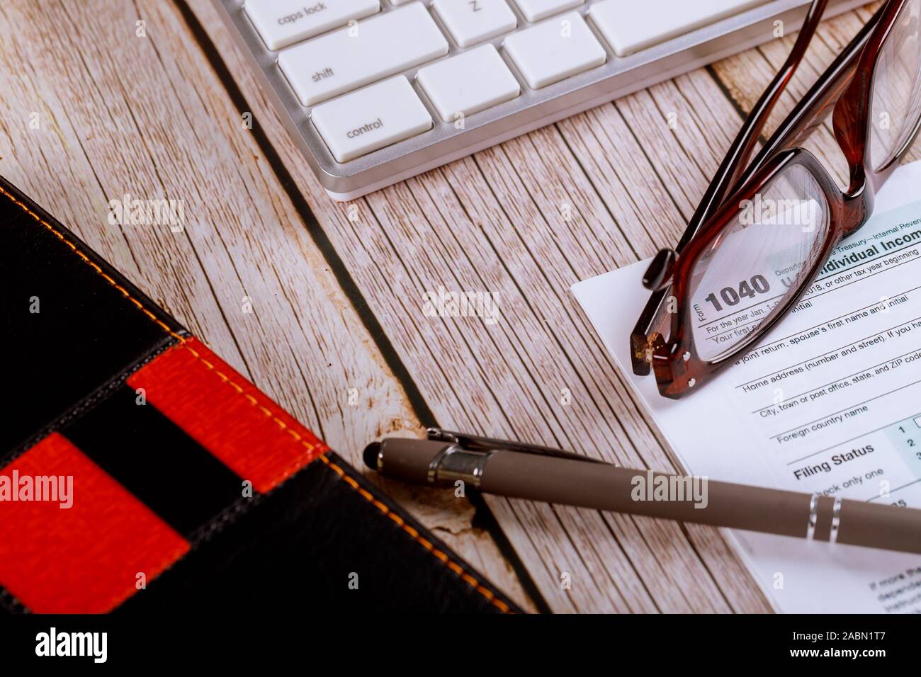Workplace in the accountant's office desk table U.S. income tax 1040 ...
