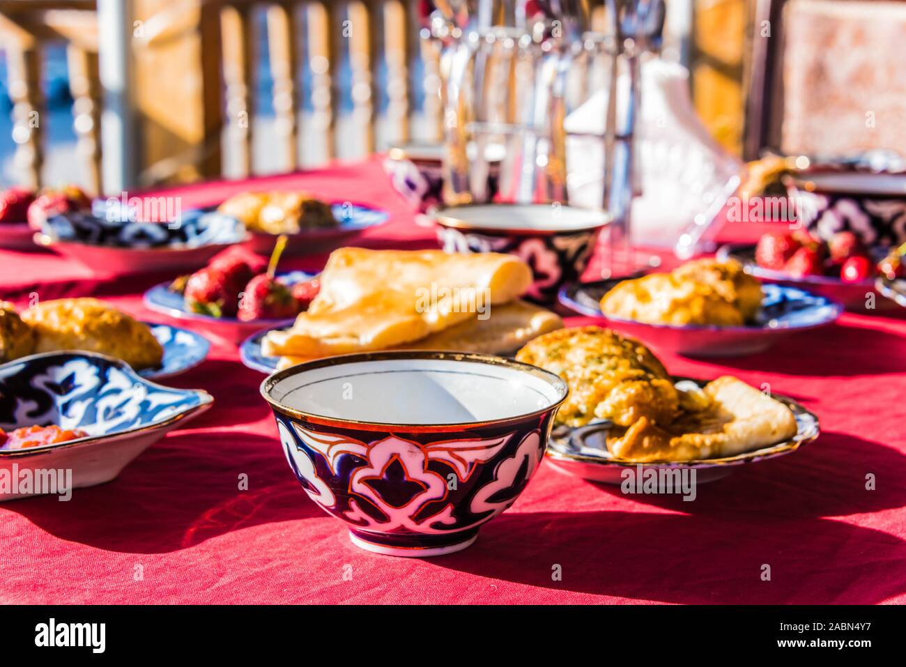 Traditional Uzbek breakfast served on the terrace Stock Photo - Alamy