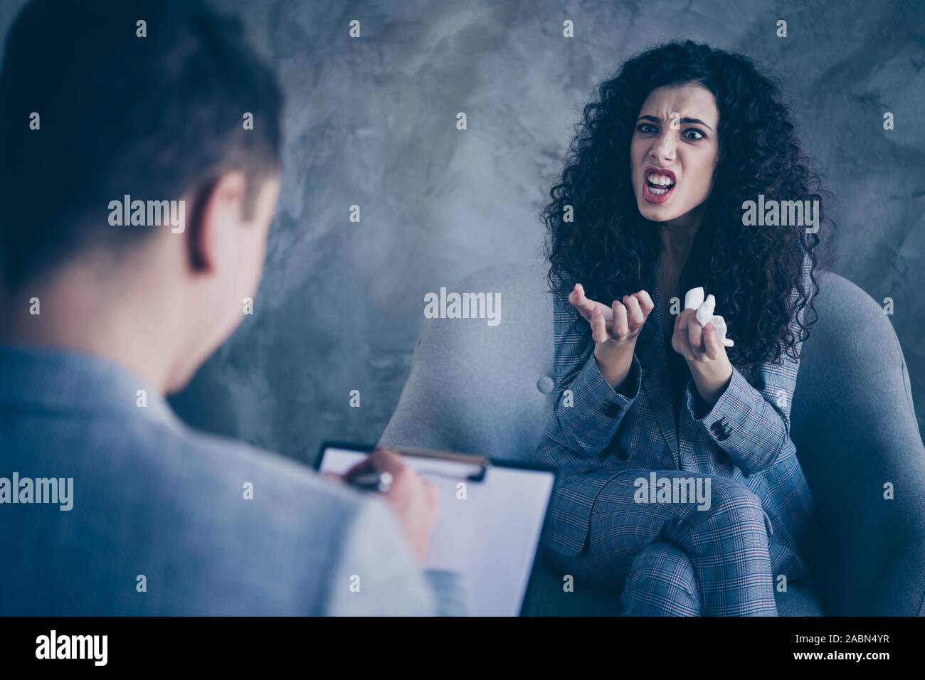 Woman sitting chair angry hi-res stock photography and images - Alamy
