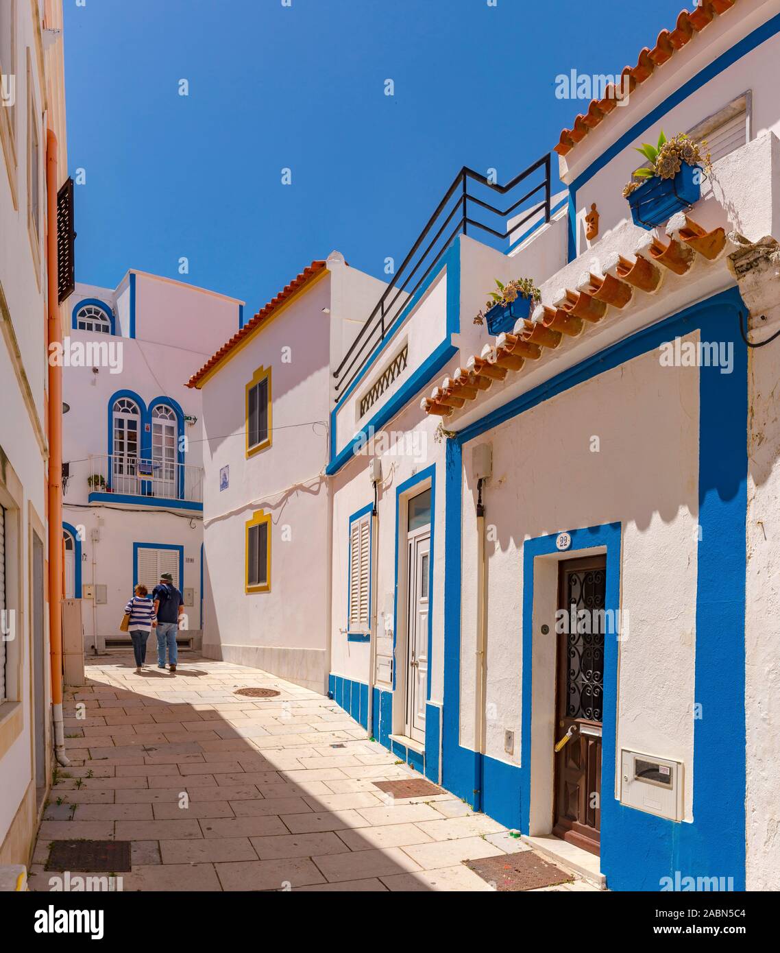 Typical portugese houses at the Rua do Mar, Armação de Pêra, Portugal ...