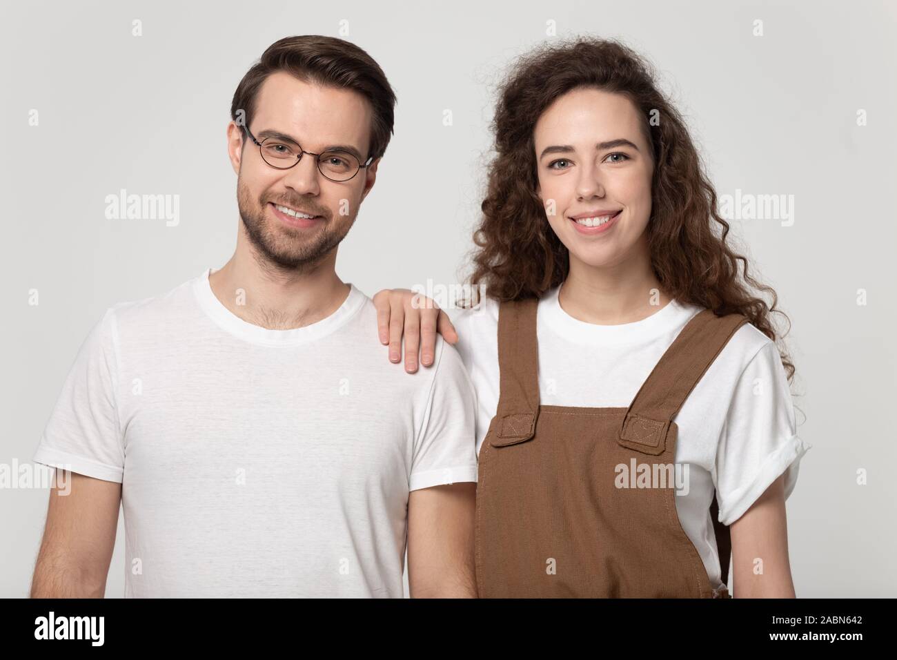Portrait of millennial couple posing for picture together Stock Photo ...