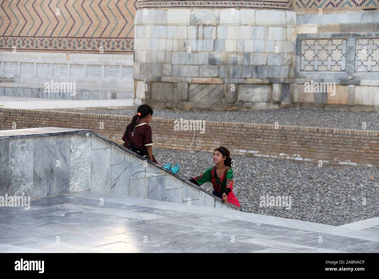 Young gypsy girls playing outside the Bibi-Khanym Mosque in Samarkand ...