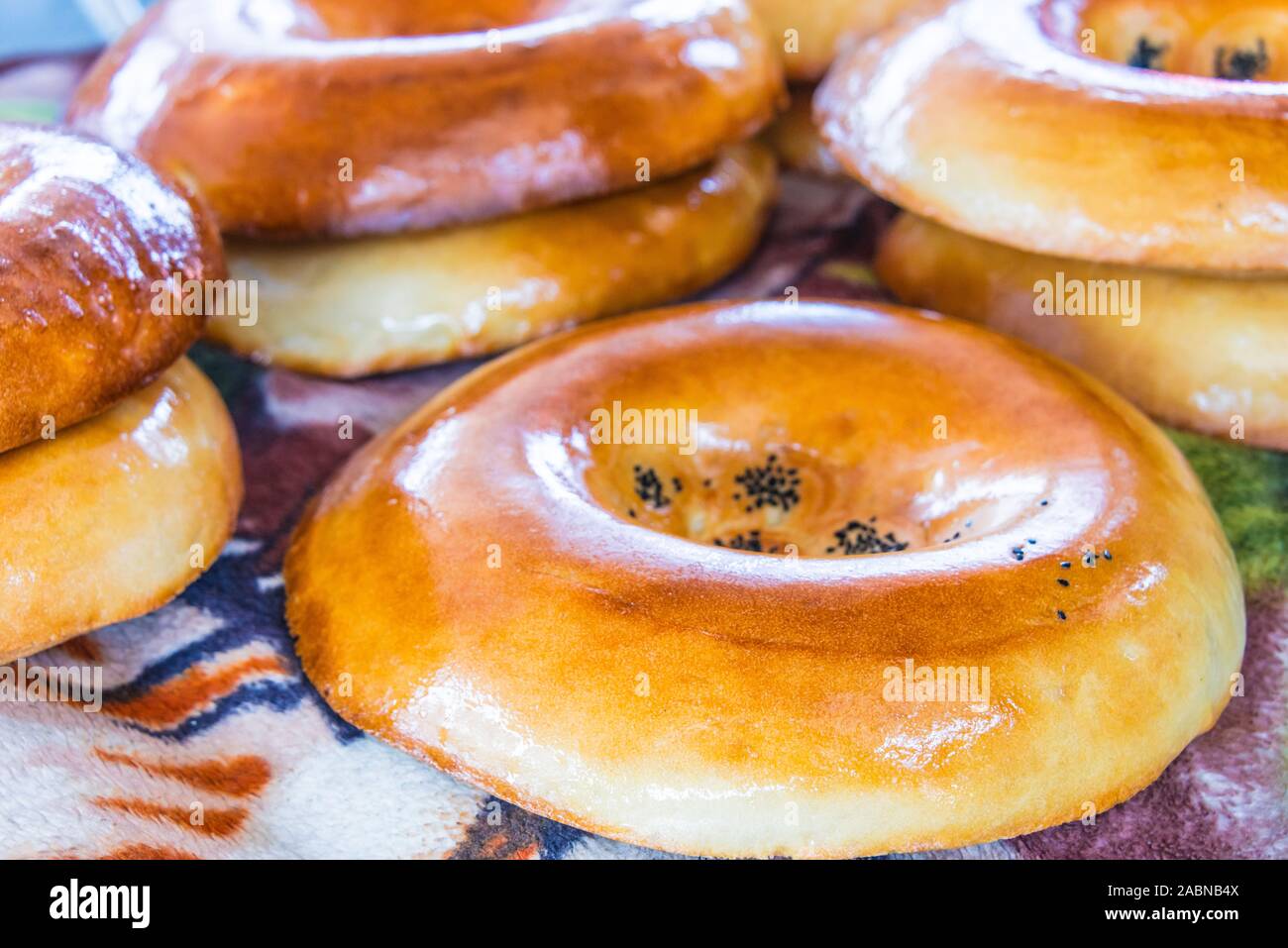 Tandir non or lepeshka, tarditional uzbek bread sold at Siab Bazaar in ...