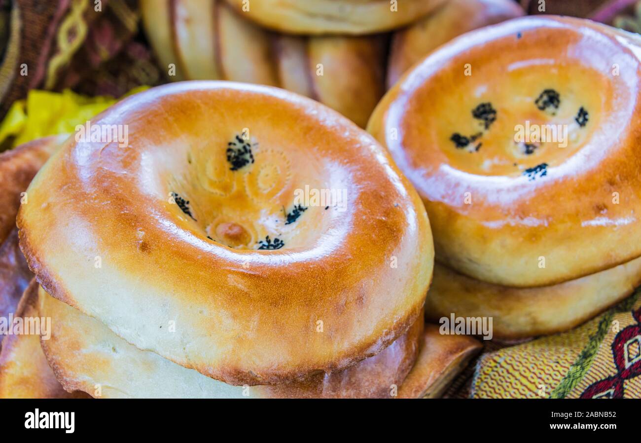 Tandir non or lepeshka, tarditional uzbek bread sold at Siab Bazaar in ...