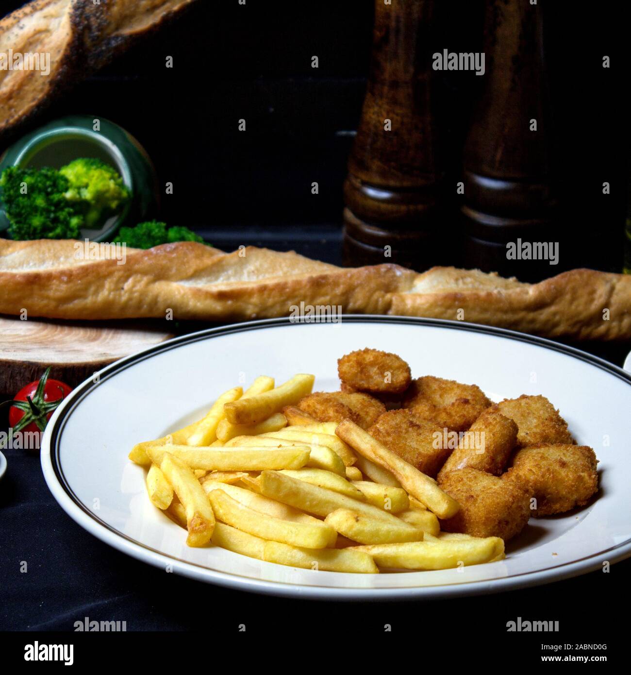 crispy chicken nuggets with fries Stock Photo - Alamy
