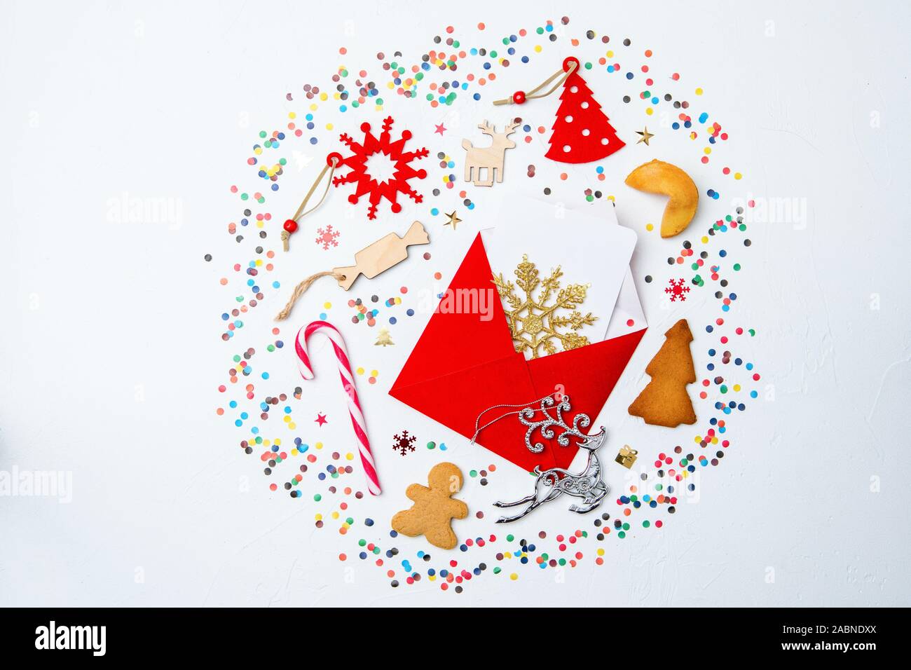 Image of red envelope, cookies, christmas decoration on empty white ...