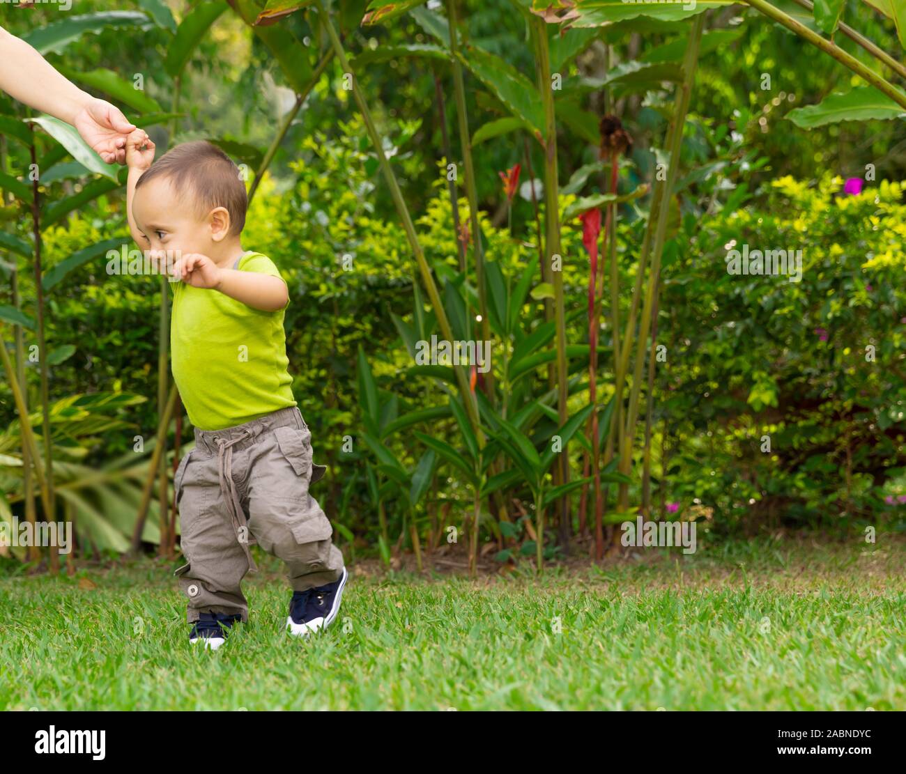 Baby learning walk in park hi-res stock photography and images - Alamy