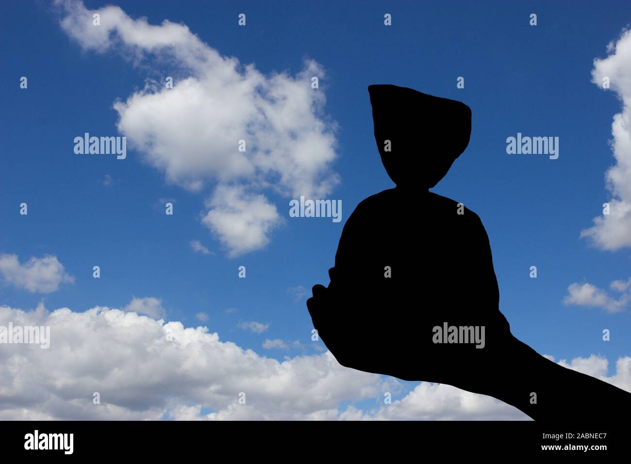 Bag full of money over sunset sky background Stock Photo - Alamy