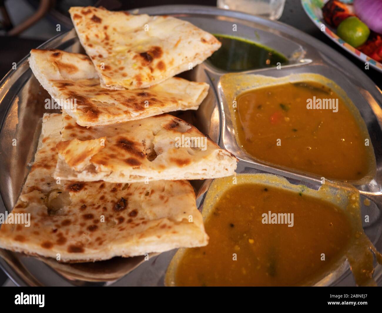 cheese naan dal and curry - Malaysian traditional food Stock Photo - Alamy