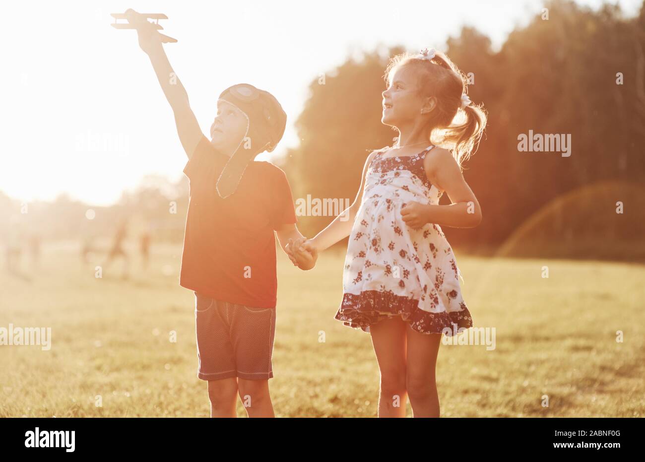 Fly into the sky. Wondering kids watching the sky, they pretend to be ...