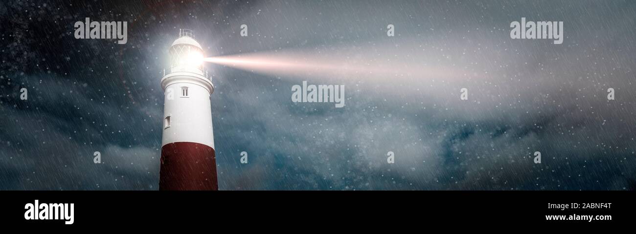 Large red and white lighthouse on a rain and storm filled night with a ...