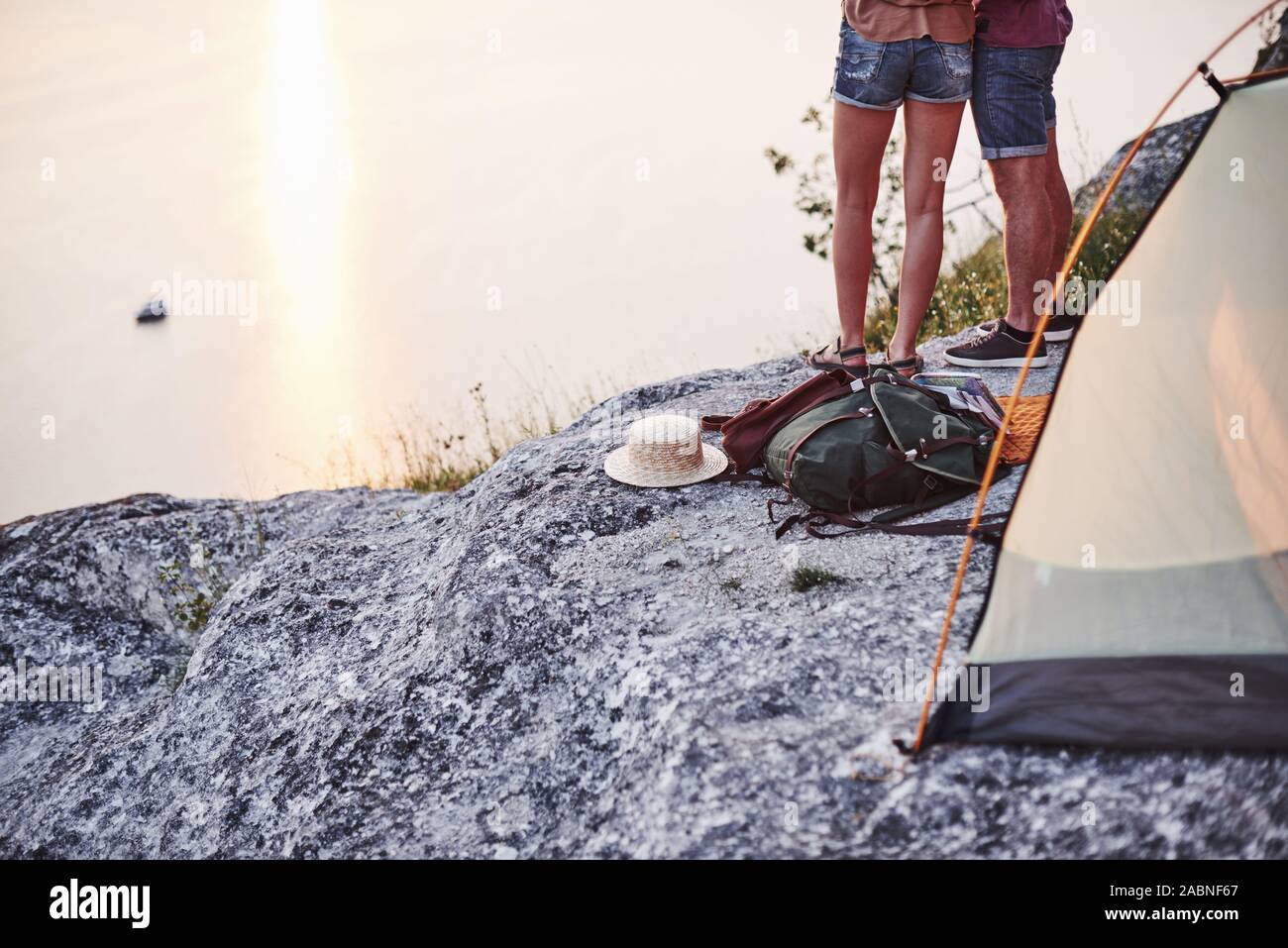 Camping near the lake, watching beautiful sunset and horizonts Stock ...
