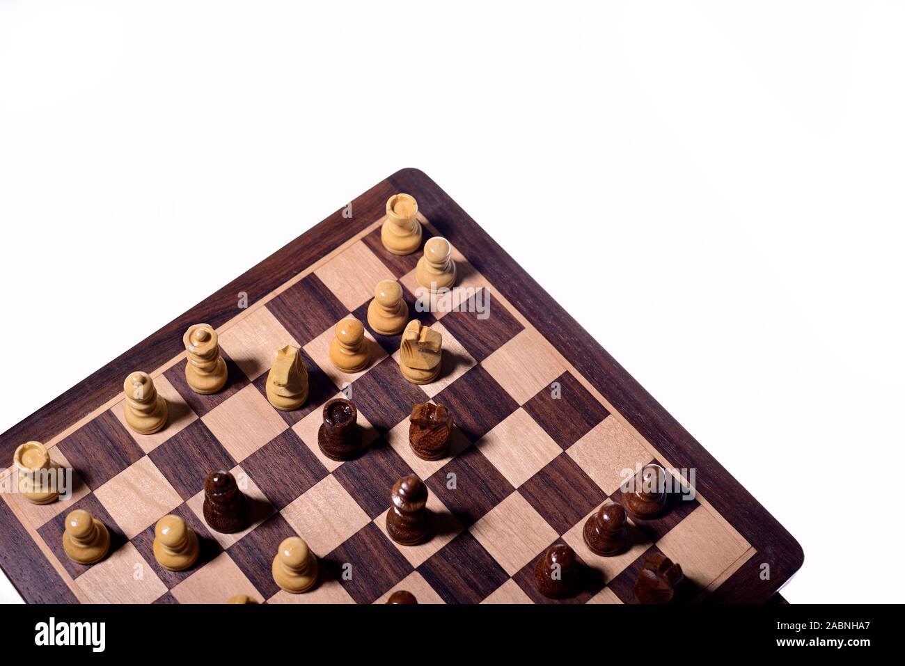Top angle shot of chess pieces on chessboard against white background ...