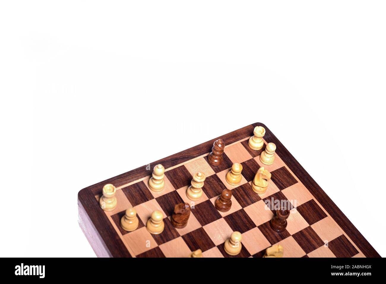 Top angle shot of chess pieces on chessboard against white background ...