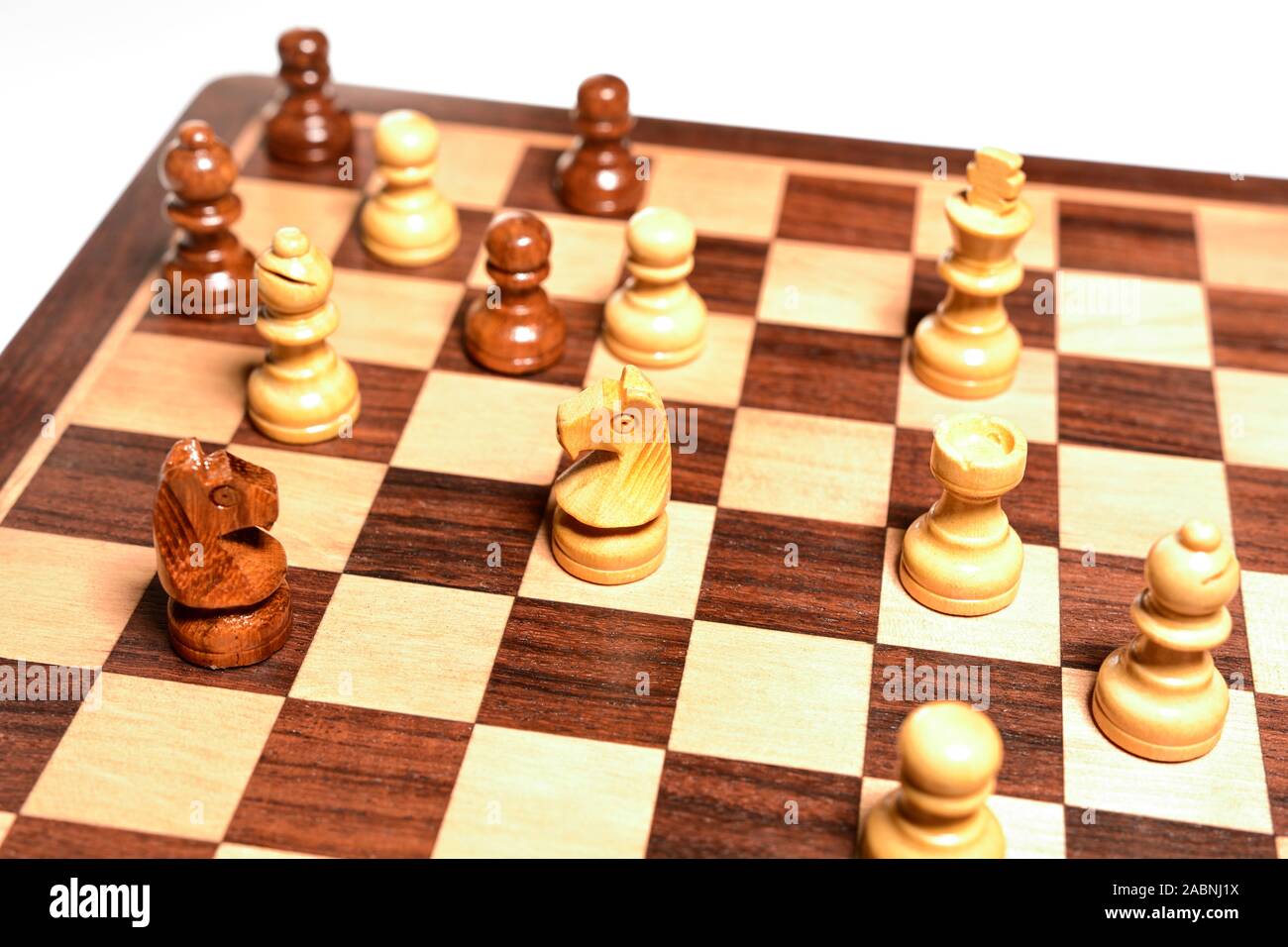Top angle shot of chess pieces on chessboard against white background ...