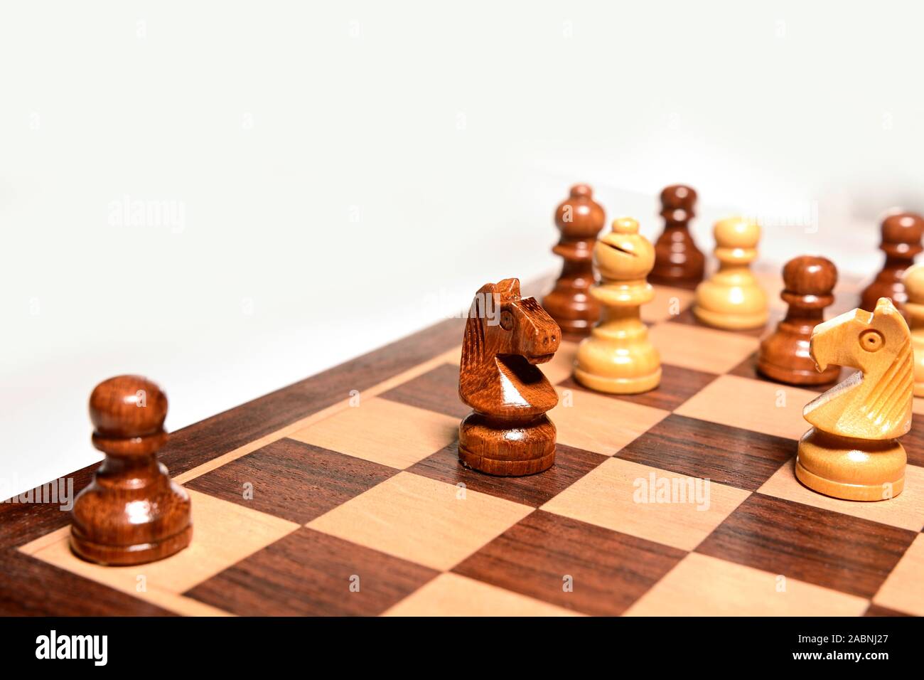 Top angle shot of chess pieces on chessboard against white background ...