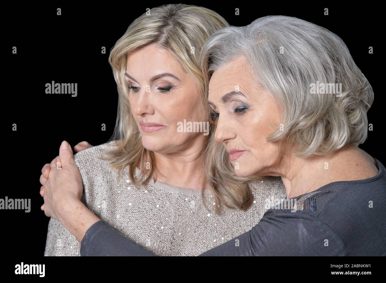 Portrait of a two sad women posing Stock Photo - Alamy