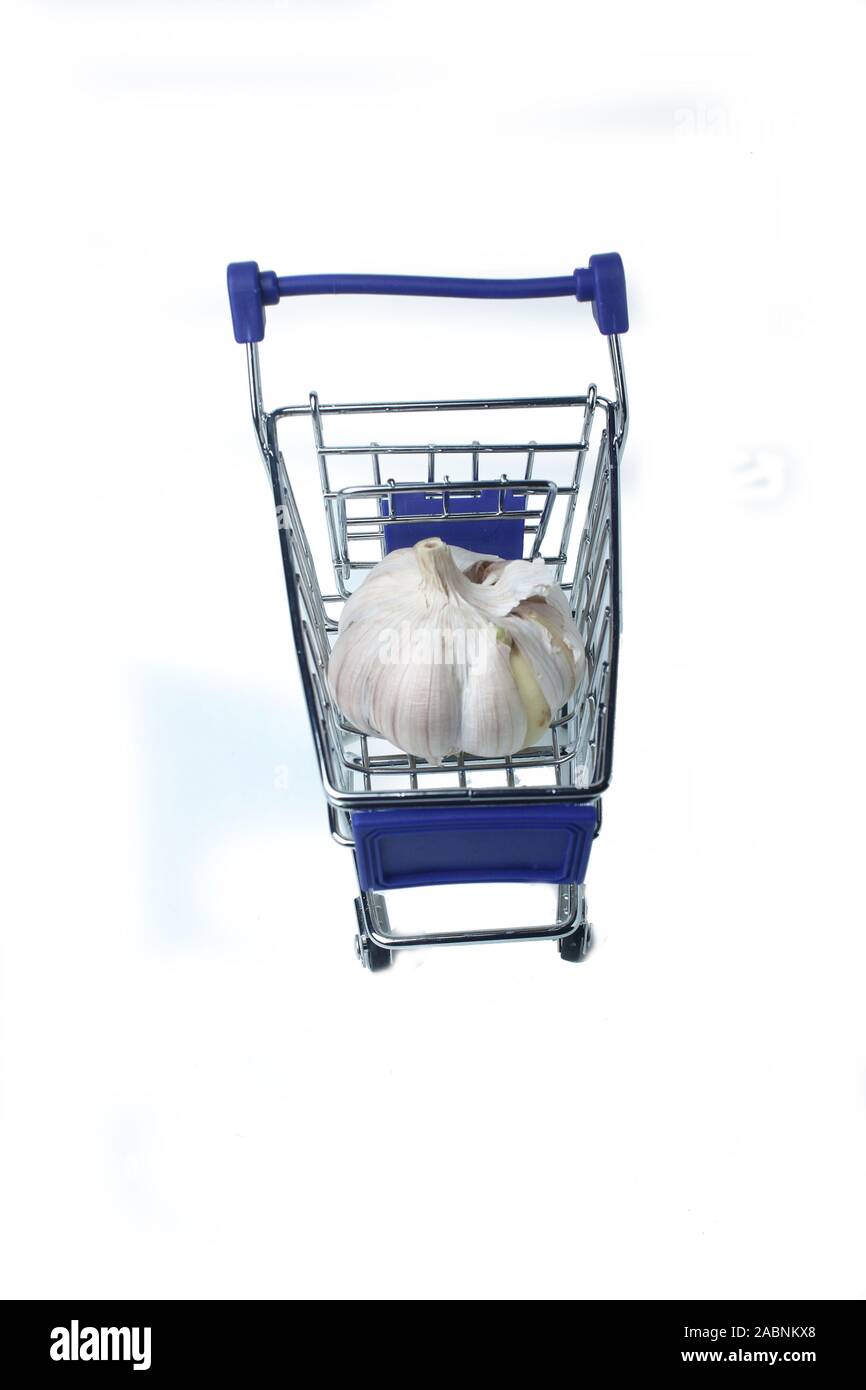 garlic bulb in a shopping cart isolated on white background. Image ...