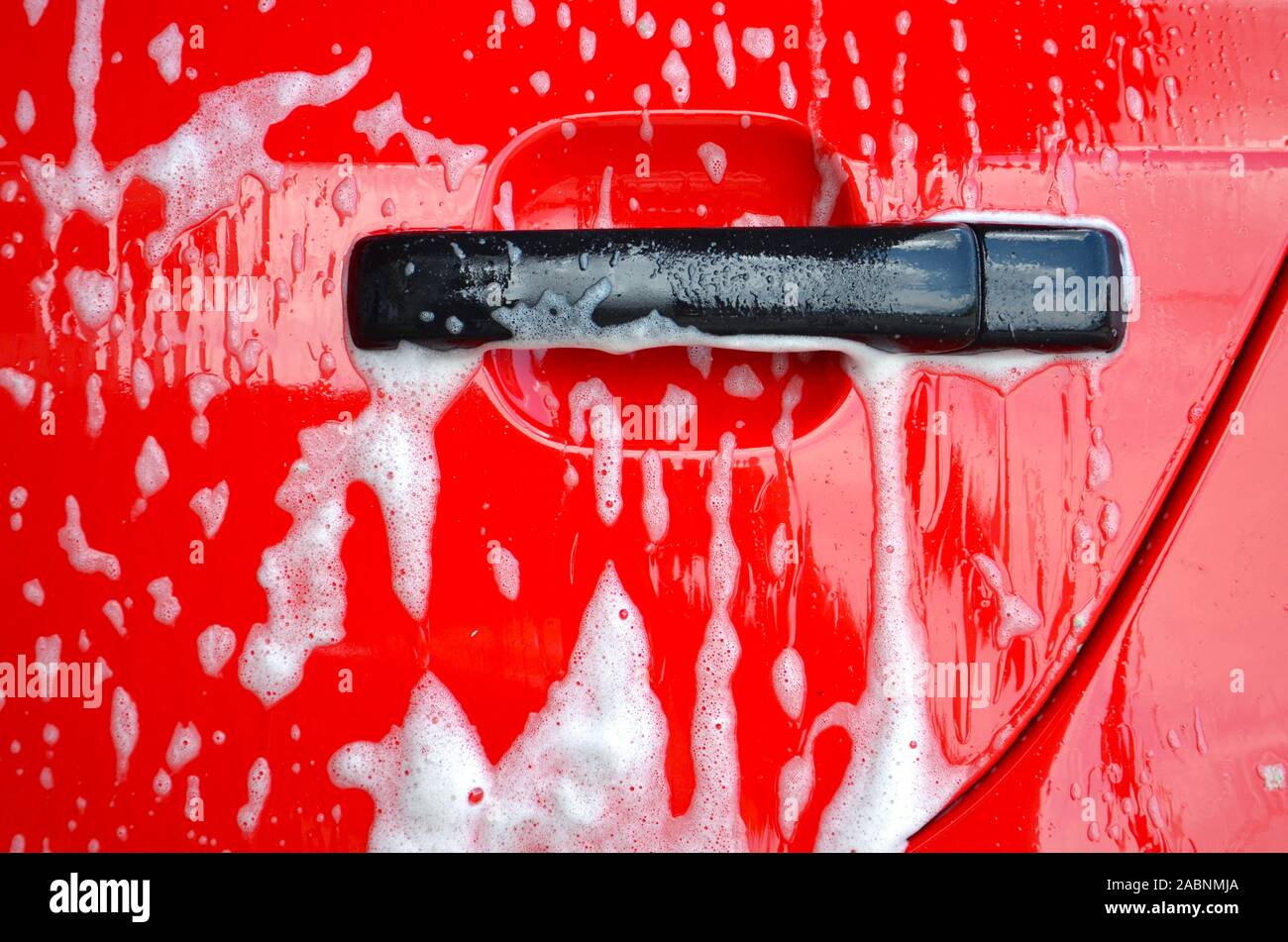 washing red car outdoor, image of a Stock Photo - Alamy