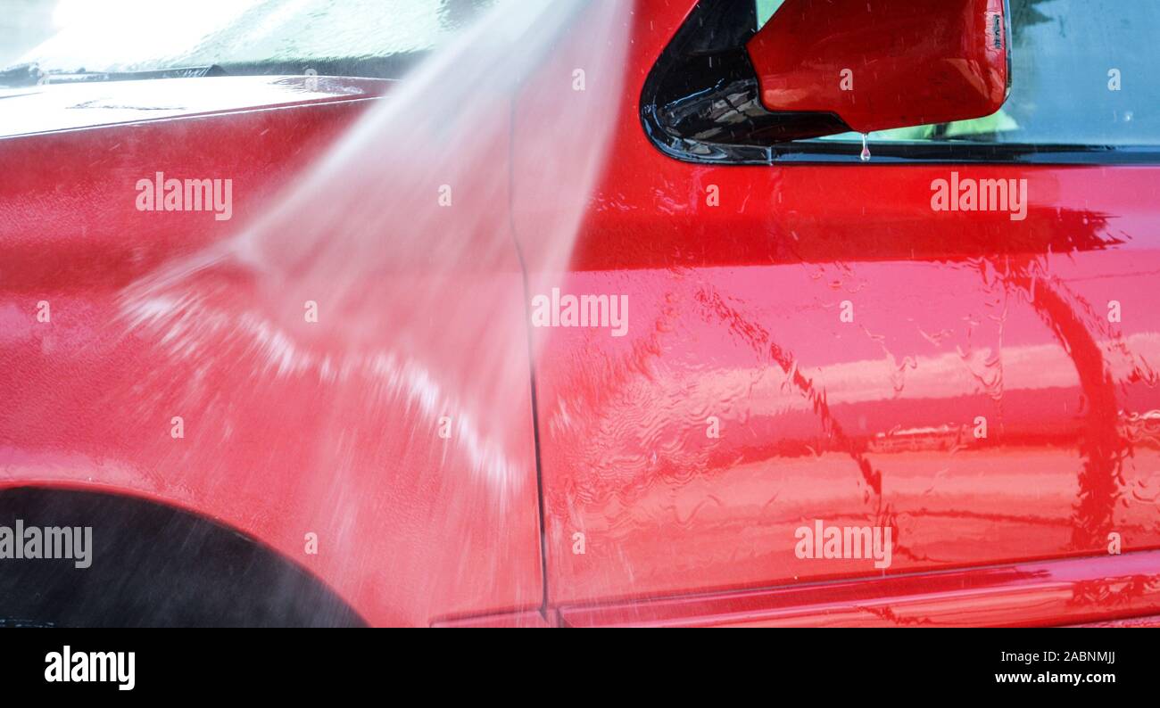 washing red car outdoor, image of a Stock Photo - Alamy