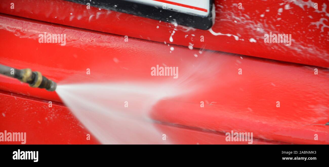 washing red car outdoor, image of a Stock Photo - Alamy
