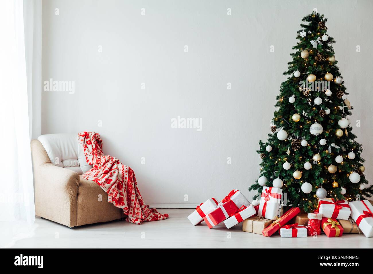 Christmas tree with gifts Of December decor in the interior of the ...