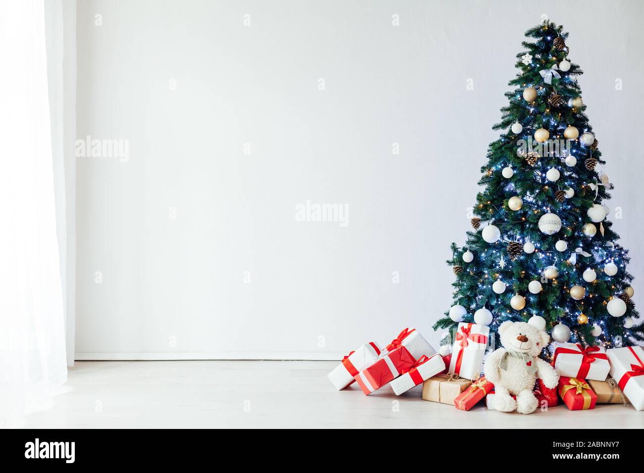 Christmas tree with gifts Of December decor in the interior of the ...