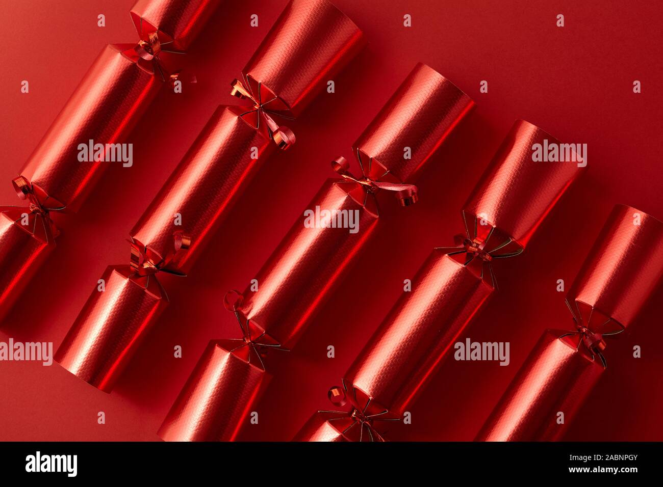 Red Christmas Crackers in a row Stock Photo - Alamy