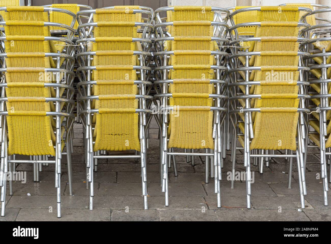 Stacked Chairs in Front of Restaurant in Venice Stock Photo - Alamy
