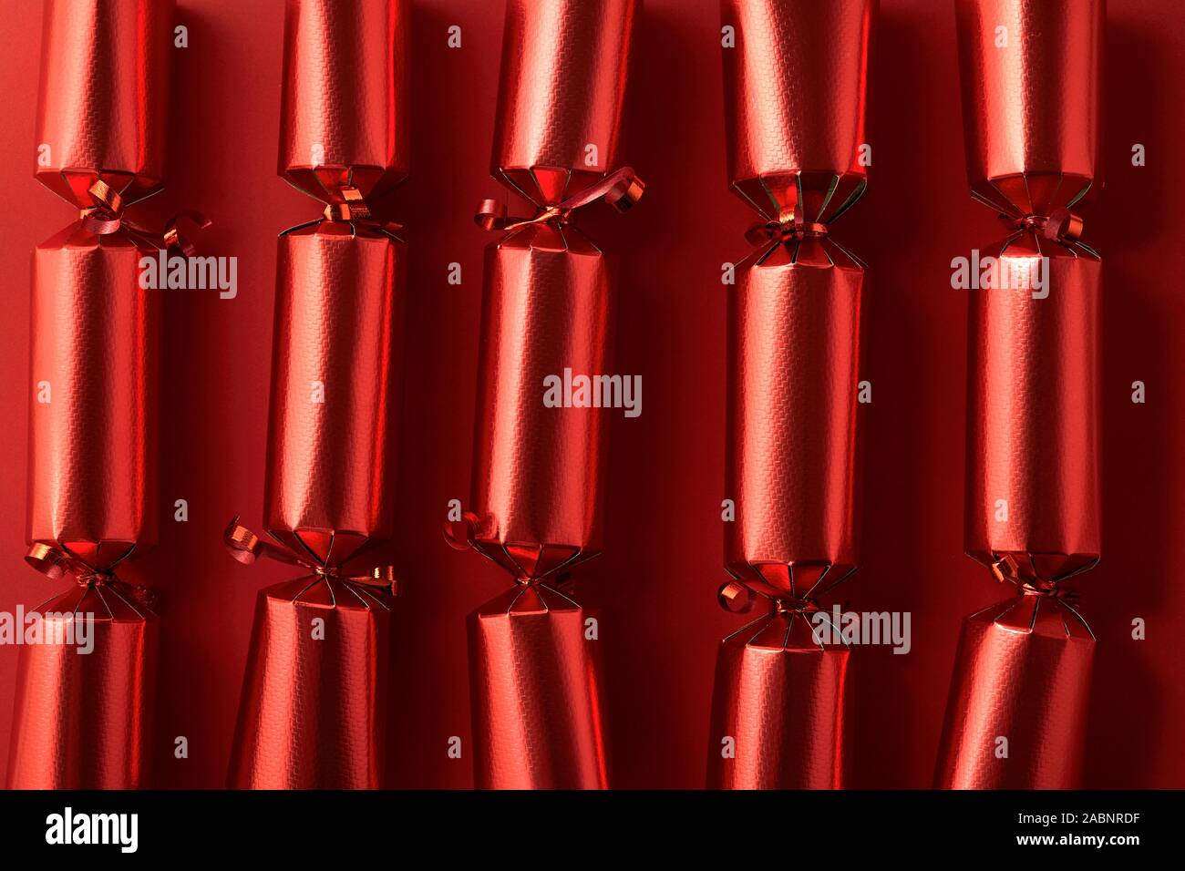 Red Christmas Crackers in a row Stock Photo - Alamy