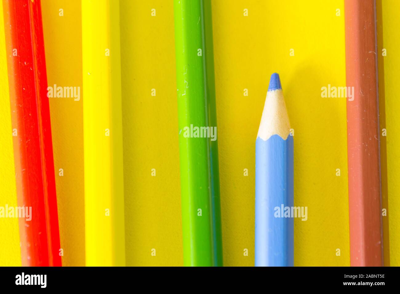 Big pencils and one small. Pencils family Stock Photo - Alamy