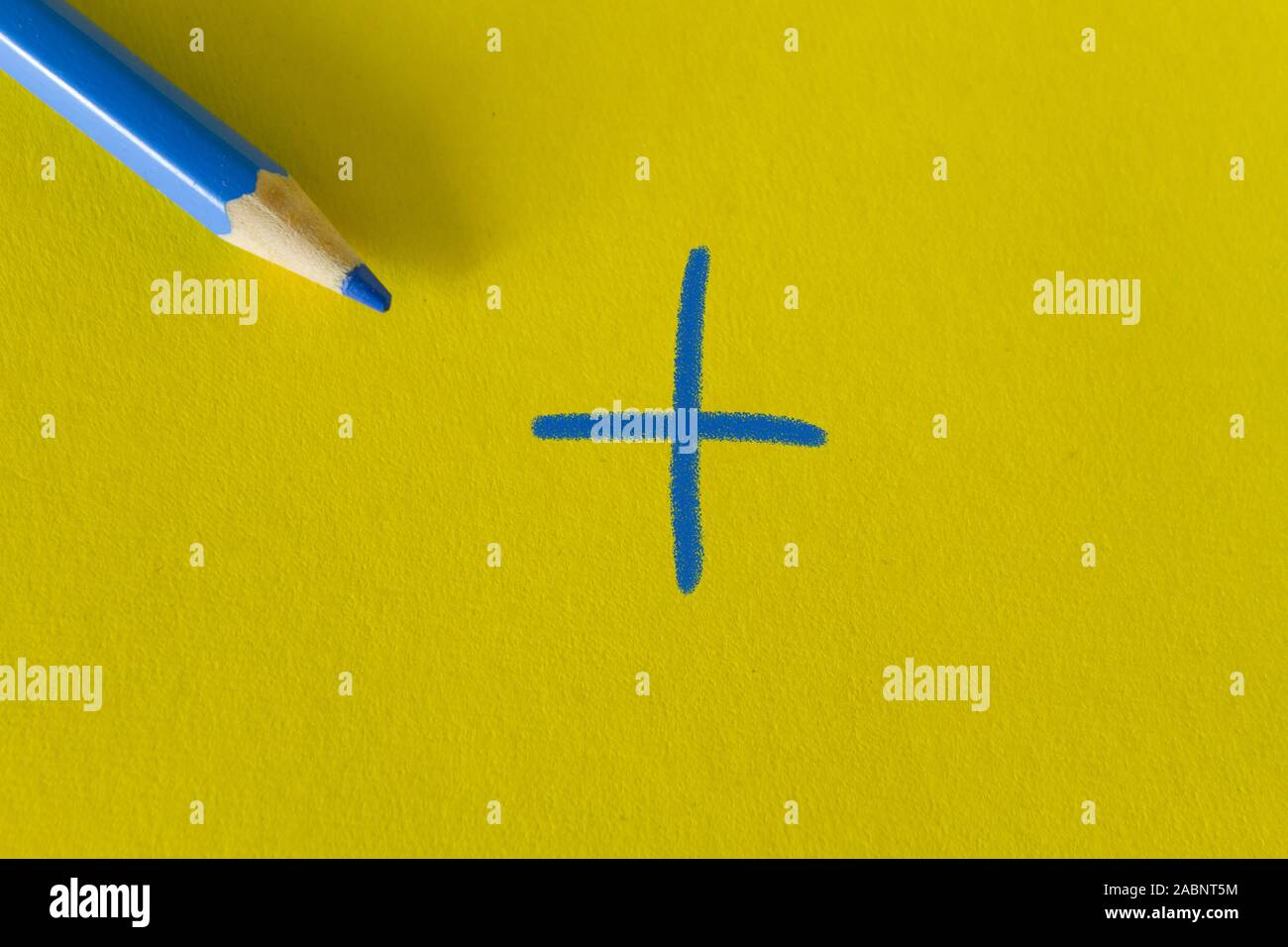 Single color pencil with plus symbol Stock Photo - Alamy