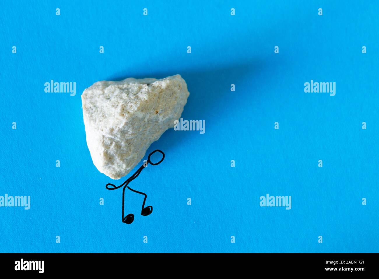 Drawing of a man carrying heavy stone Stock Photo - Alamy