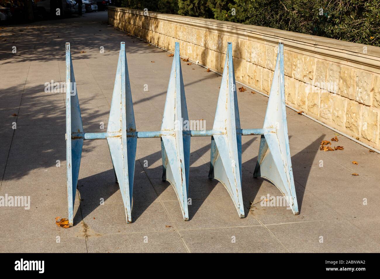iron barrier on the sidewalk. barrier is made of steel to prevent the ...