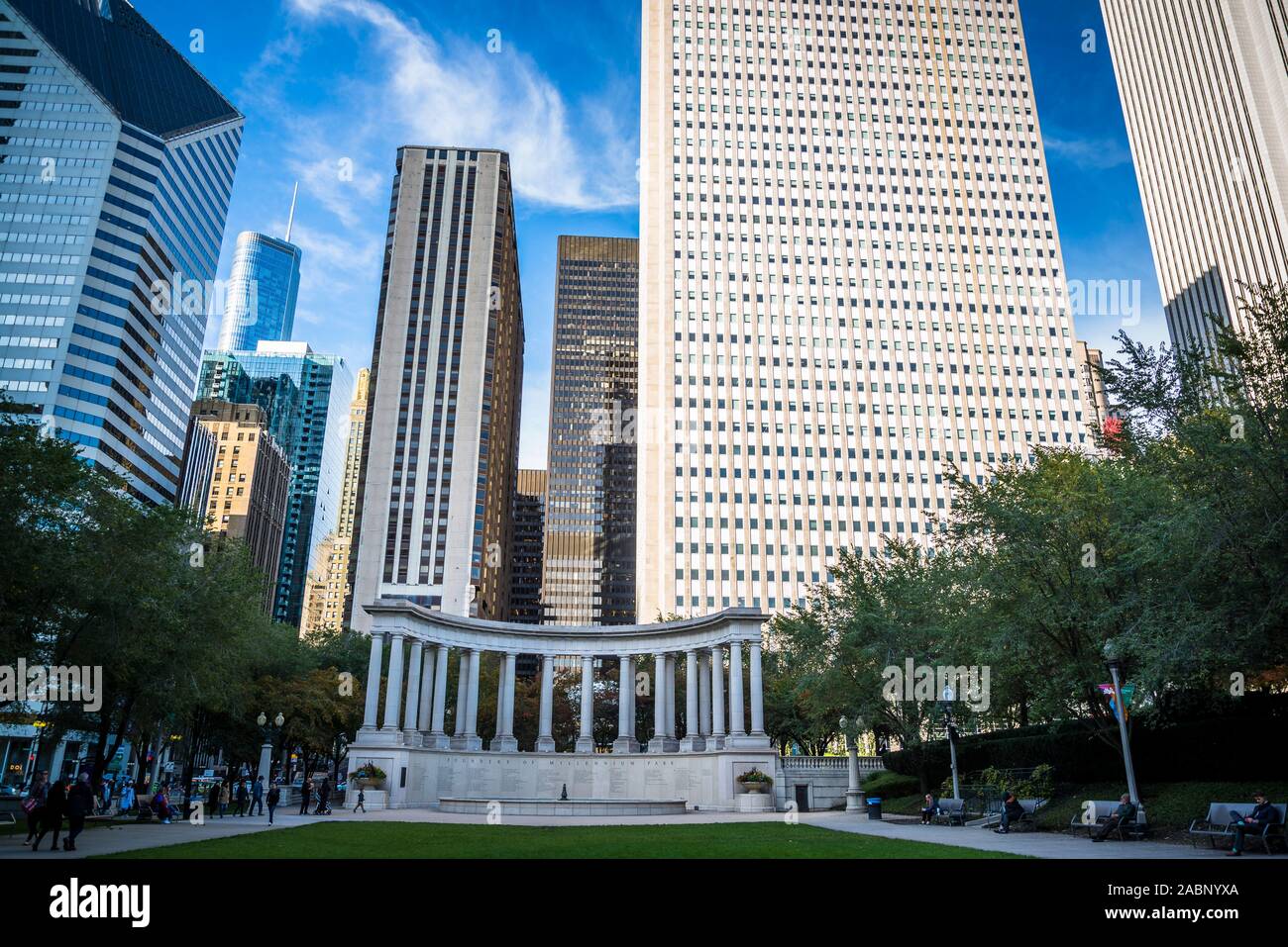 Millennium Monument in the Millennium park dwarfed by the skyscrapers ...