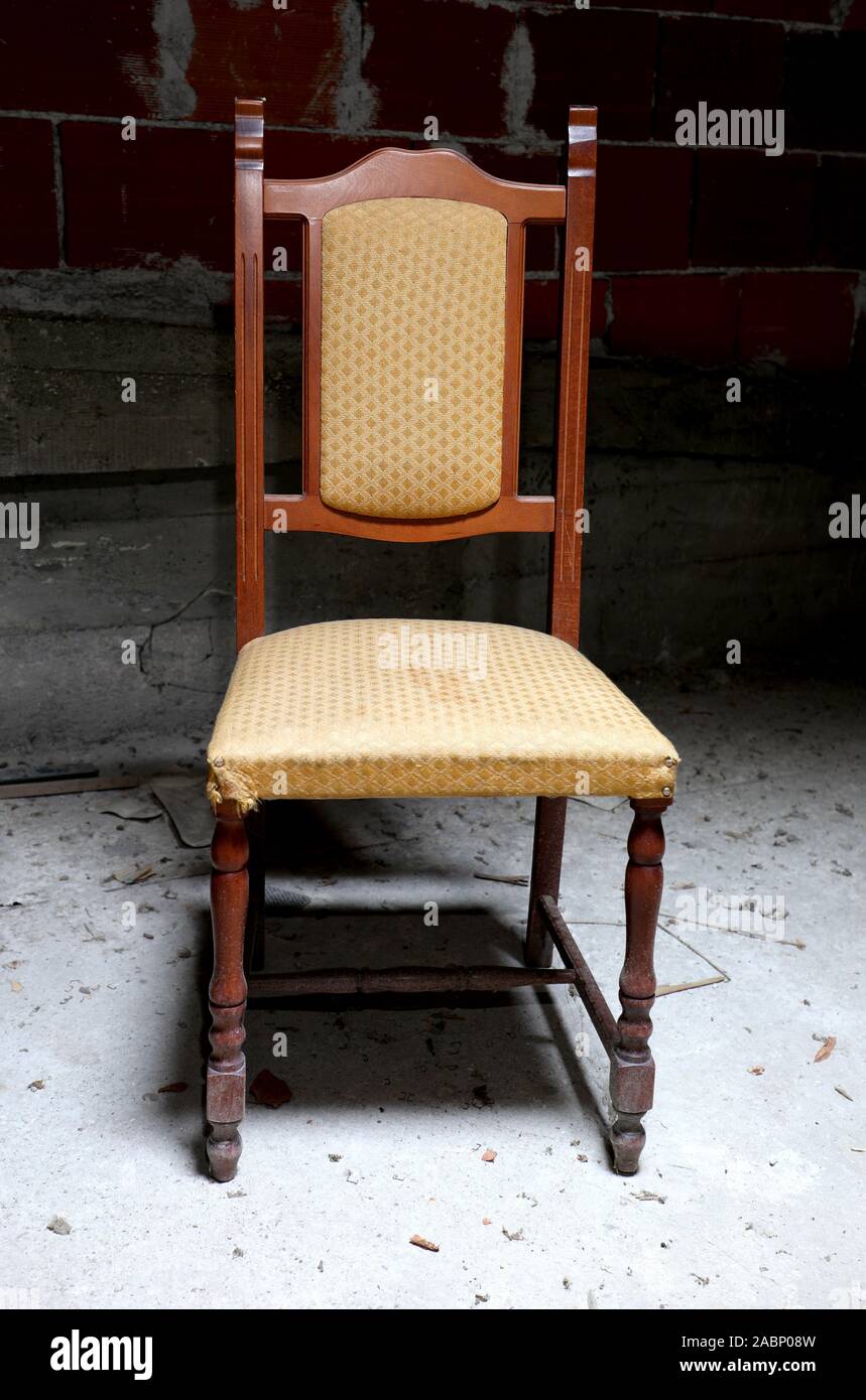 Old wooden chair in the attic of an house Stock Photo - Alamy
