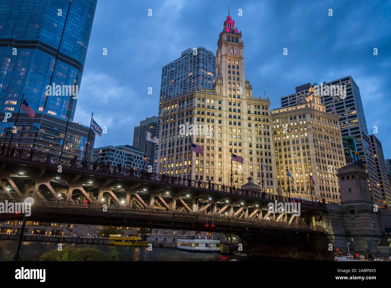The Wrigley Building, a 1924 landmark skyscraper and clocktower, and DuSable Bridge, Chicago ...
