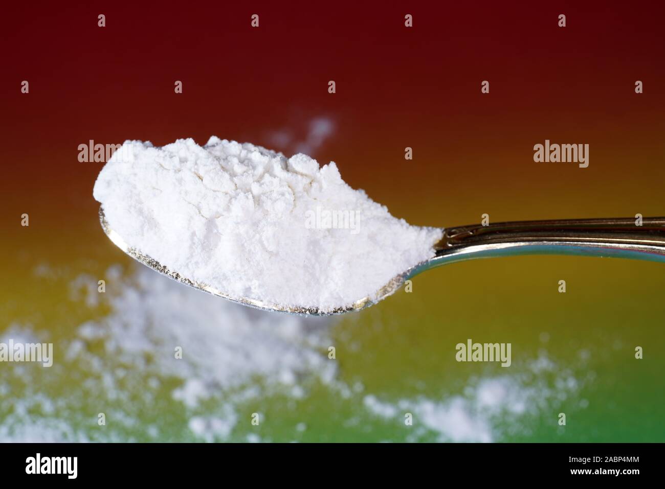 Flour with macro lens photographed against colorful gradient in studio ...