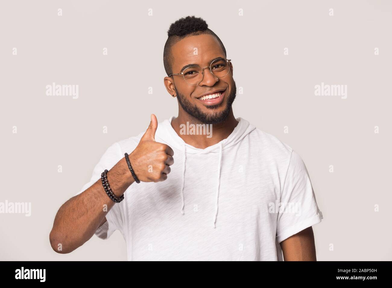 Happy African American man showing thumbs up gesture, satisfied client ...