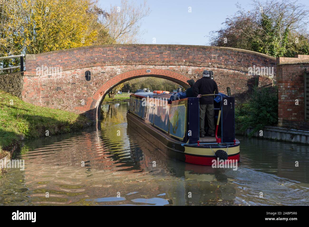 Autumn scene; narrowboat at Bridge 2 on the Grand Union canal ...