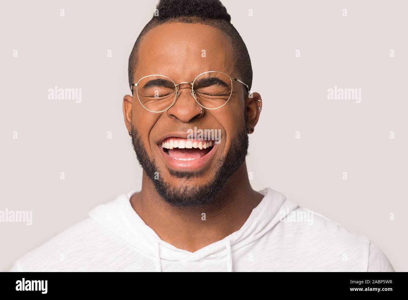 Funny African American man with healthy smile laughing close up Stock ...