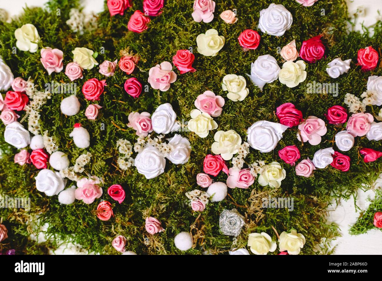 Small roses of many colors in a bouquet of decoration Stock Photo - Alamy
